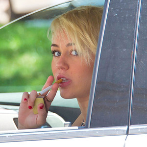 Miley Cyrus Puffs Cigarette, Shows Off Smoking New Haircut in ...