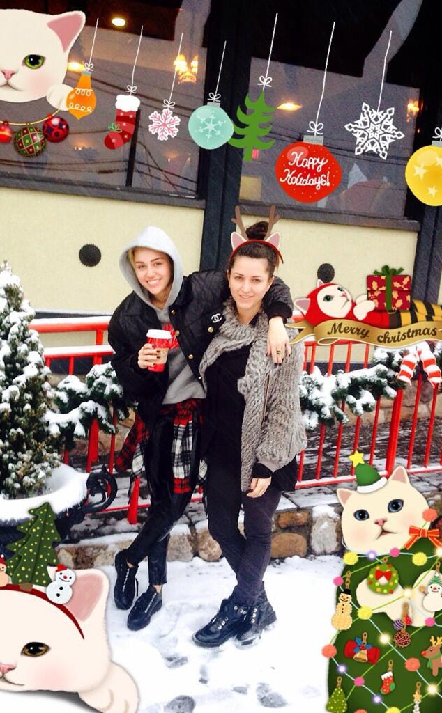 Miley Cyrus Rings In The Holidays By Freeing Her Nipples Hangs With Slutty Santas And More Cats