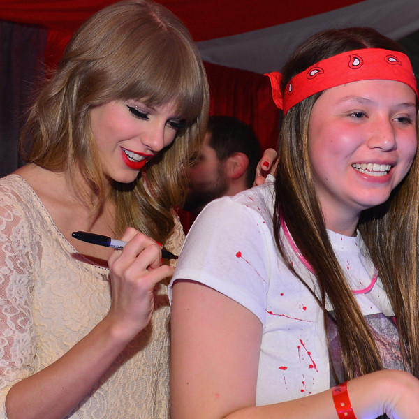 Photos from Stars Signing Fans' Body Parts - E! Online